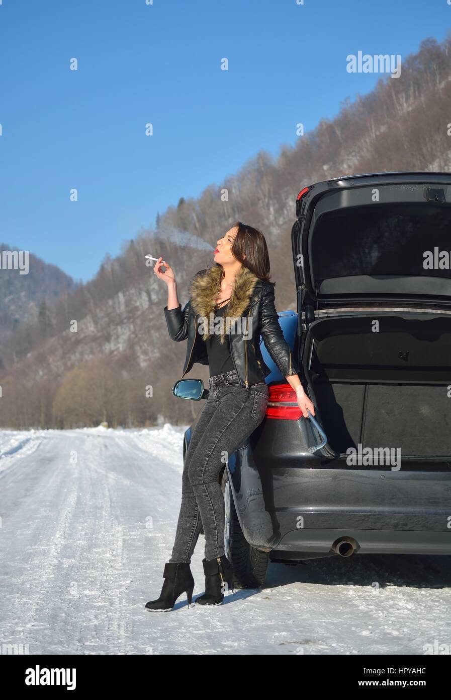 Young woman smoking outdoor hi-res stock photography and images - Alamy