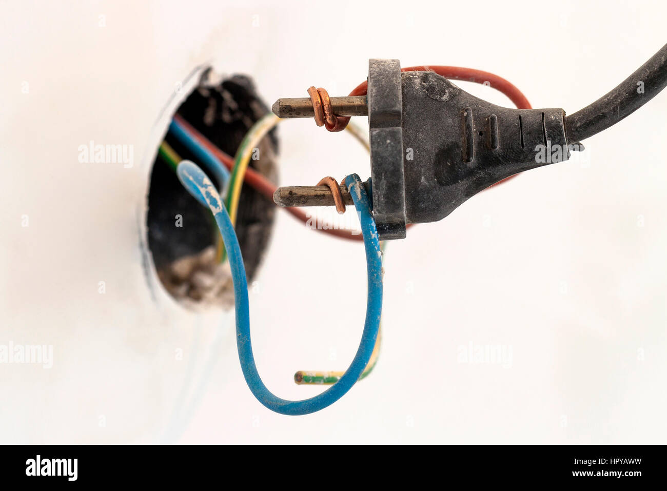 Badly wired plug showing bad and wrong and dangerous connection Stock ...