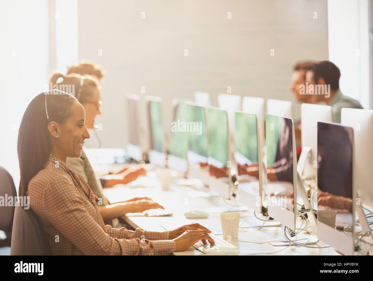 Business people headsets using computers hi-res stock photography and ...