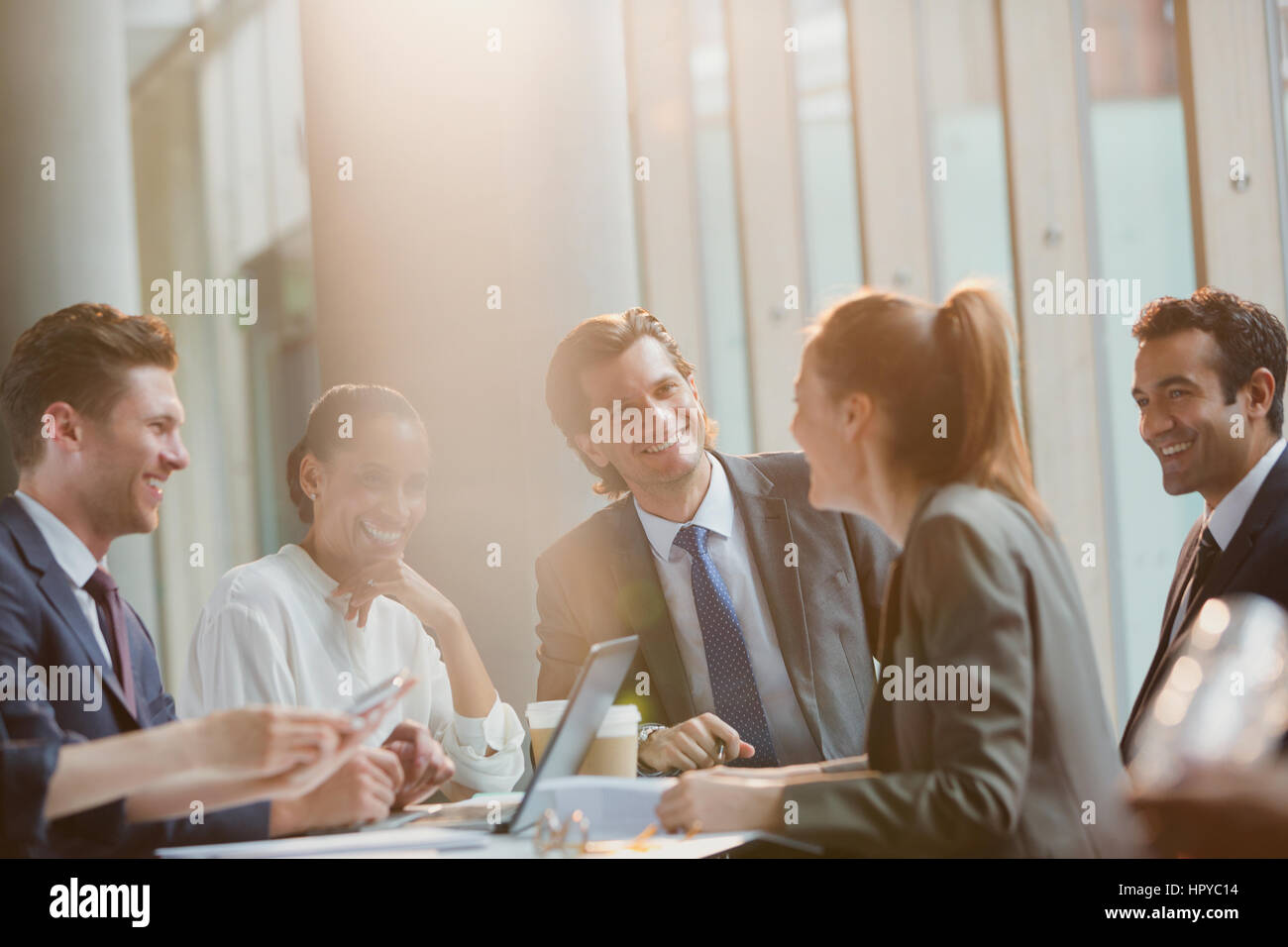Smiling business people in conference room meeting Stock Photo - Alamy