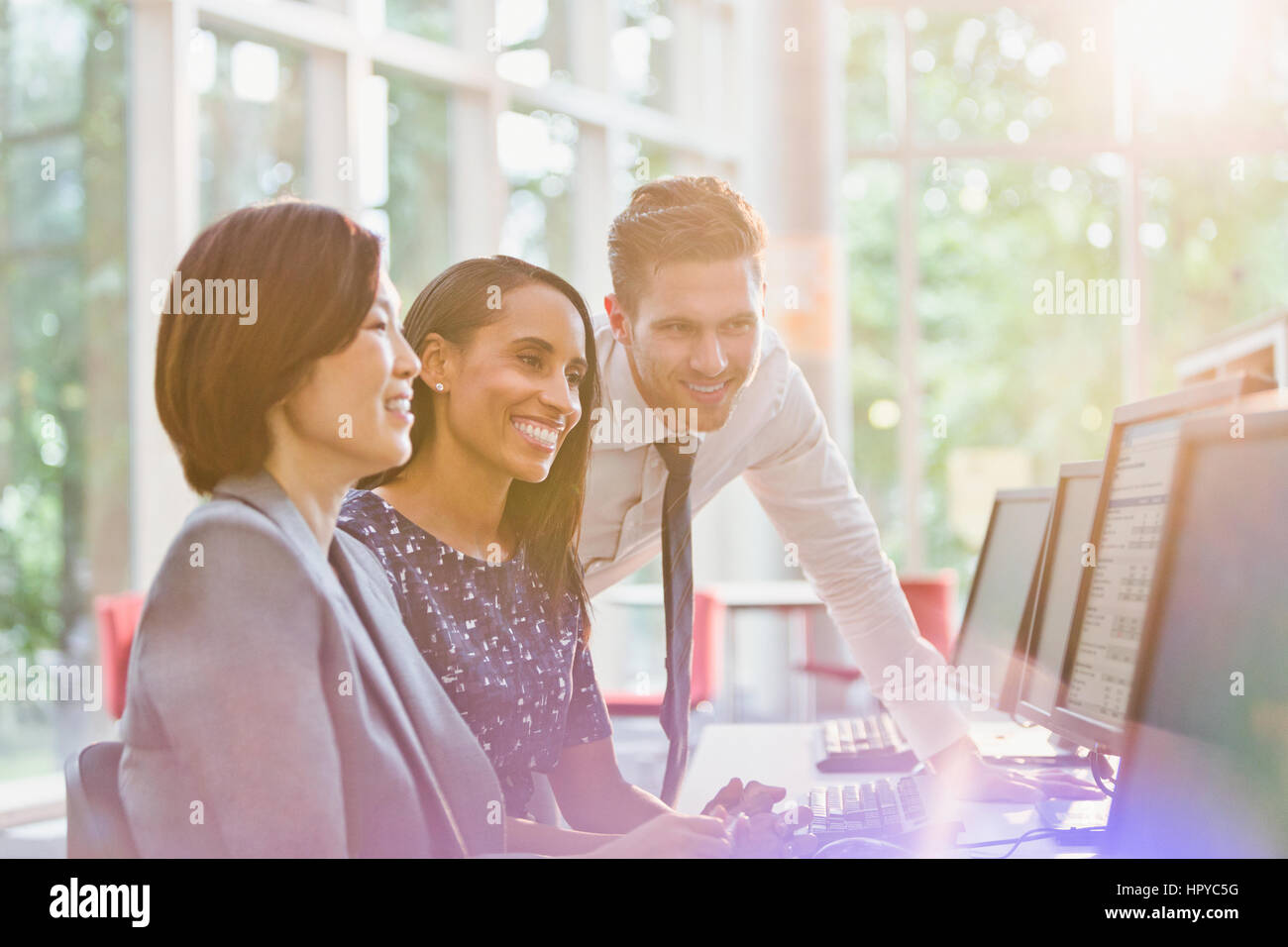 Business people working at computer in office Stock Photo - Alamy