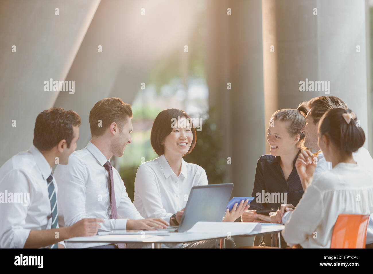 Business people talking at laptop in conference room meeting Stock ...
