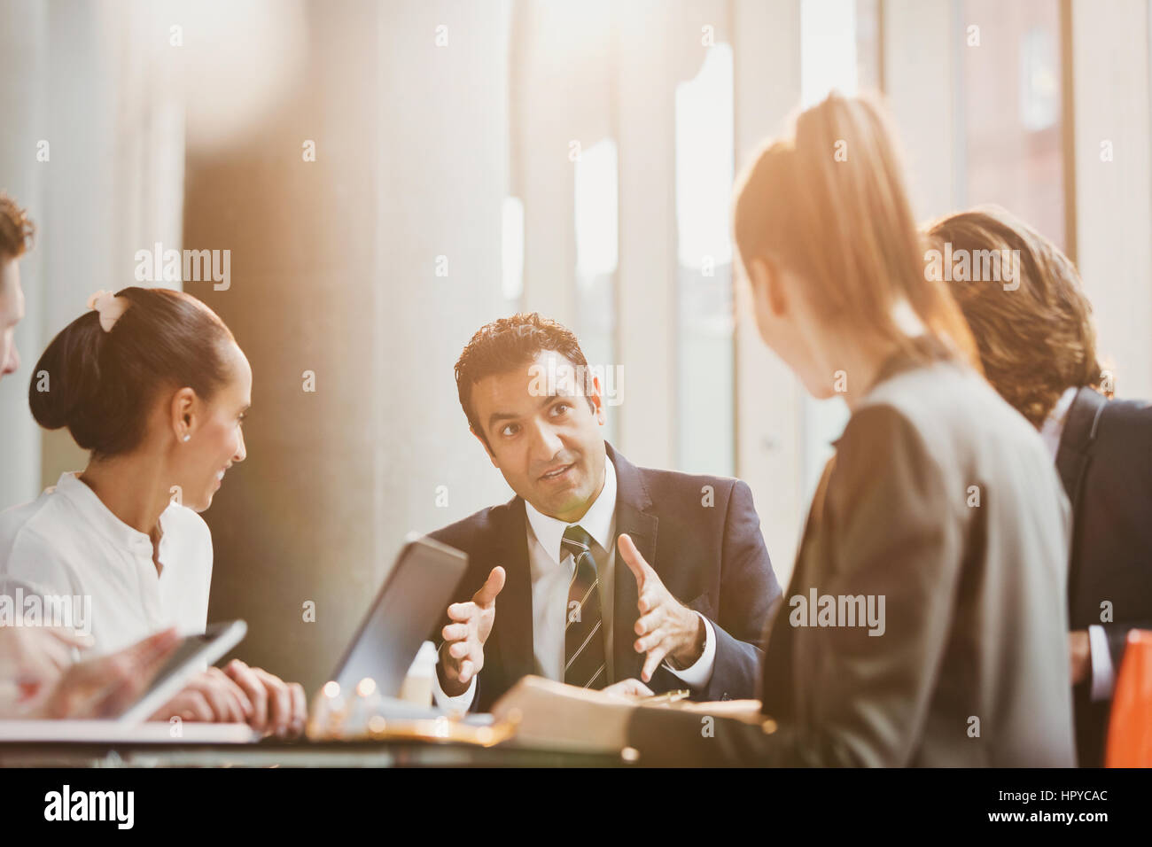 Businessman talking, leading conference room meeting Stock Photo - Alamy