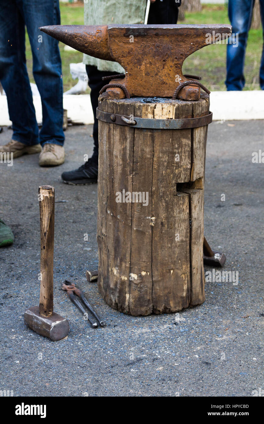 Forging iron on the street. Manufacturing of the knife Stock Photo - Alamy