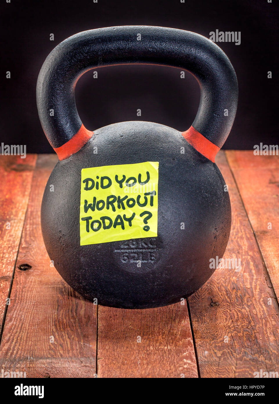 Did you workout today reminder note on a heavy iron kettlebell on a ...