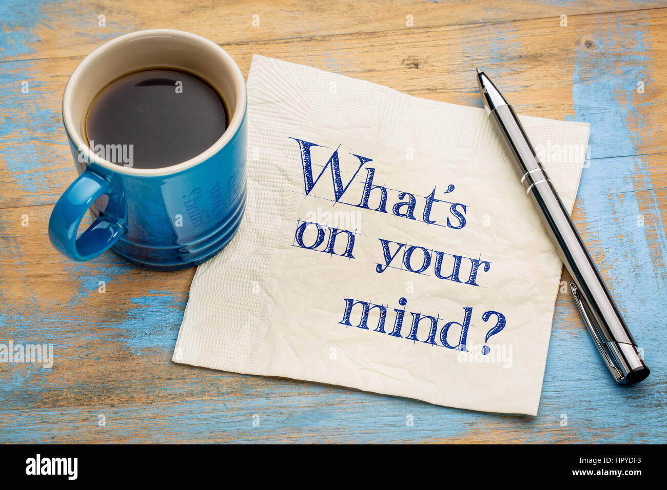What is on your mind question - handwriting on a napkin with a cup of ...