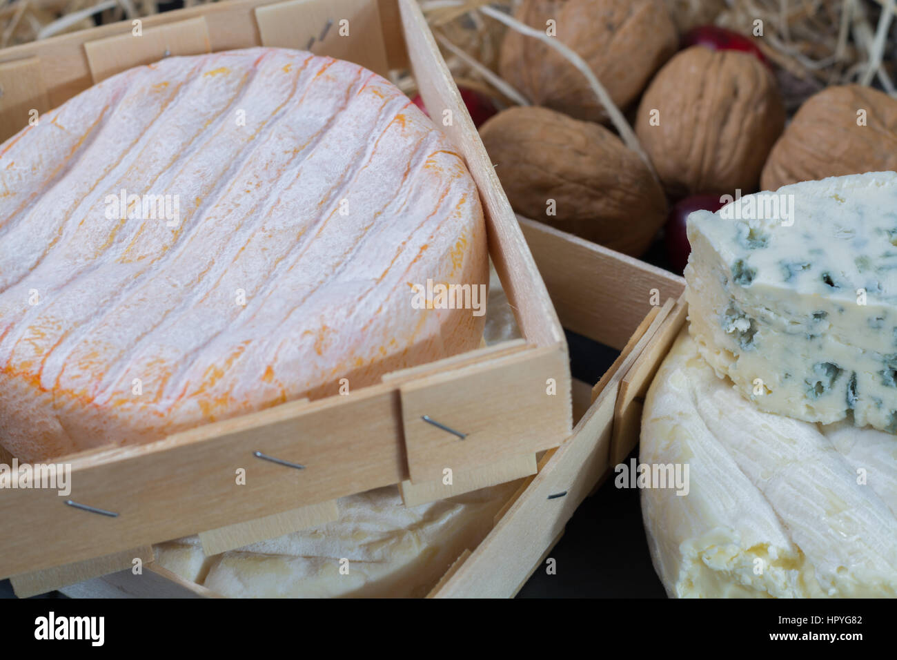French soft cheeses on black stone platter Stock Photo - Alamy