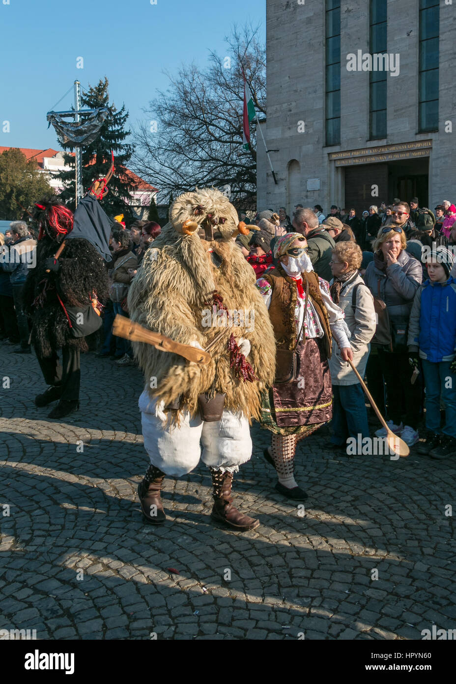 Masked busos walking the streets of Mohacs as part of the Busojaras ...