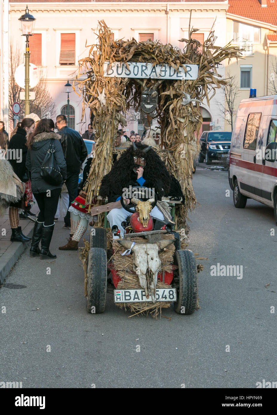 Masked busos walking the streets of Mohacs as part of the Busojaras ...