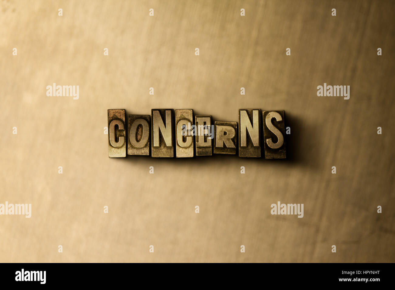 CONCERNS - close-up of grungy vintage typeset word on metal backdrop ...