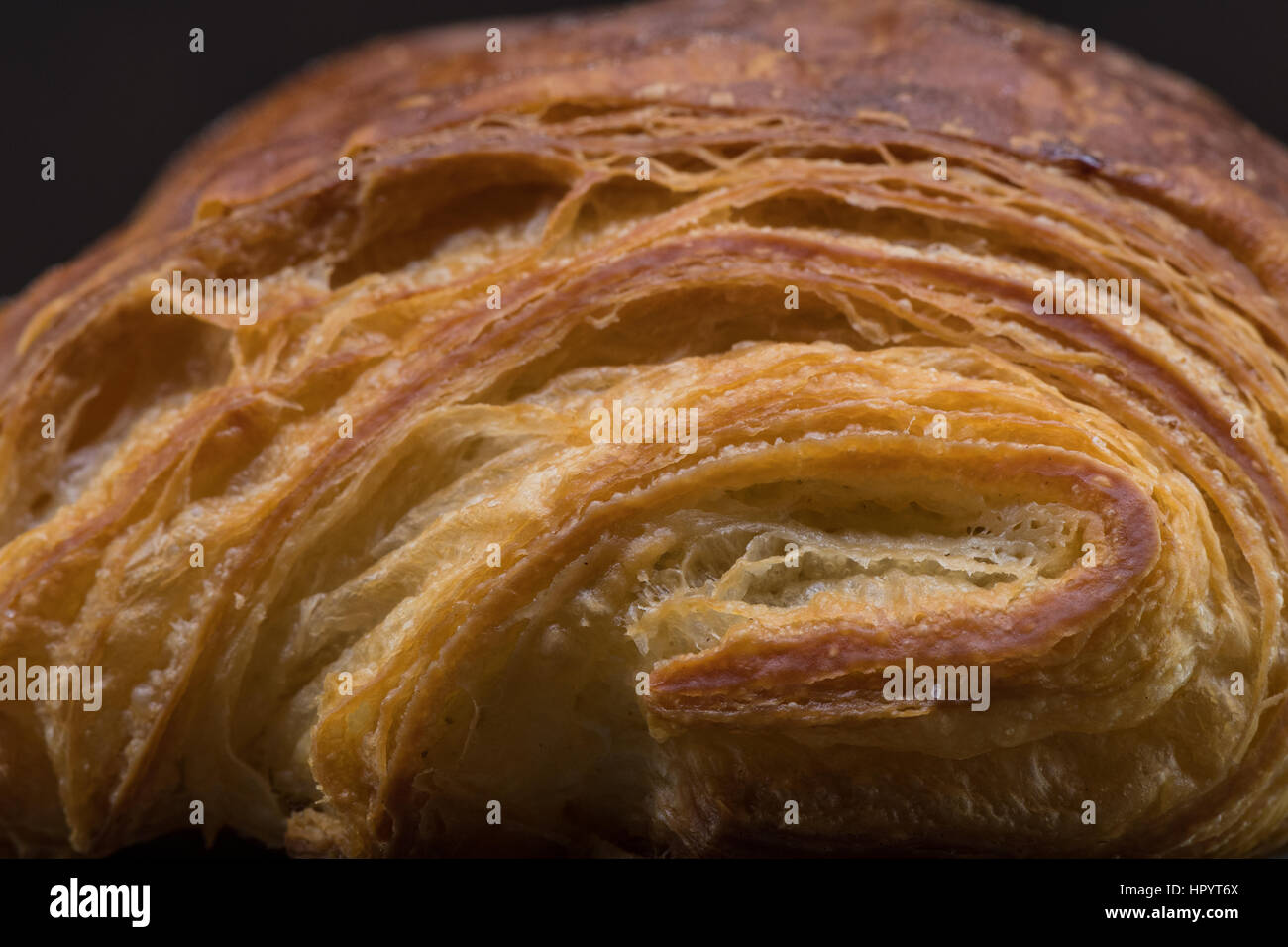 Brightly Lit Layers of Croissant Pastry texture Stock Photo - Alamy