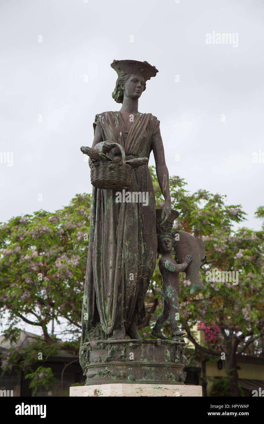 Statue of woman with child carrying the fish Stock Photo - Alamy