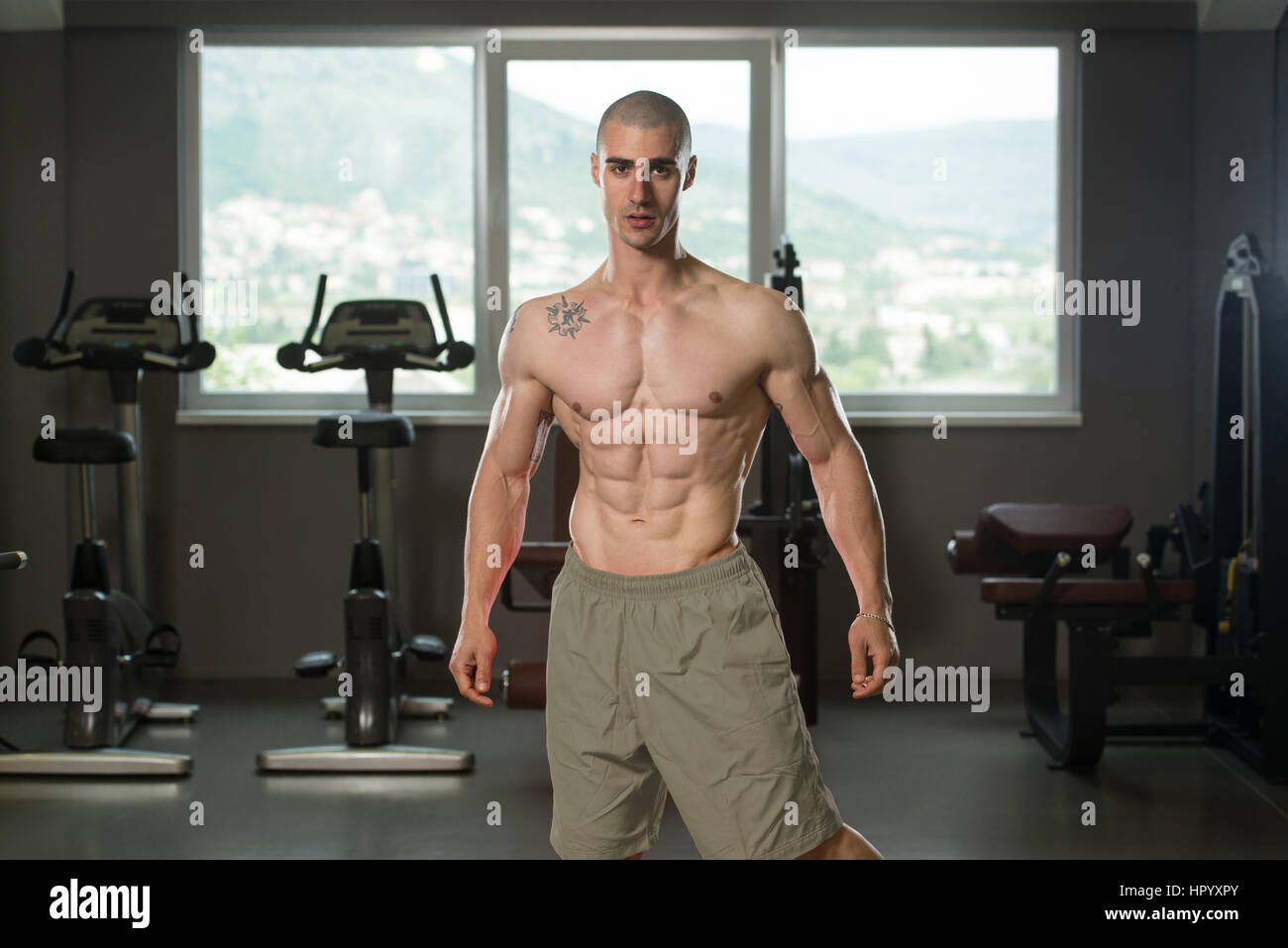 Portrait Of A Young Physically Fit Man Showing His Well Trained Body ...