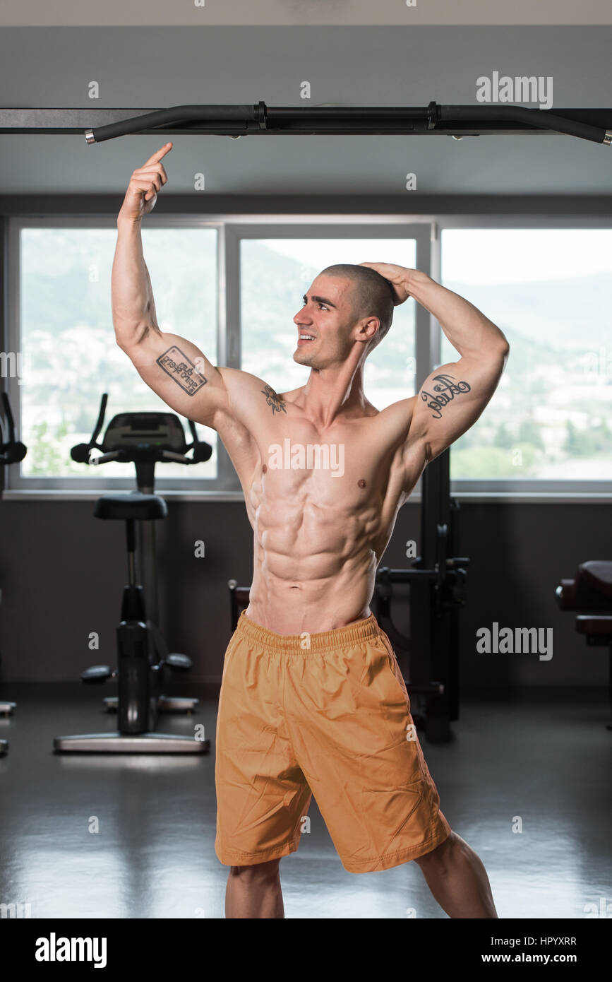 Bodybuilder Posing In Different Poses Demonstrating Their Muscles ...