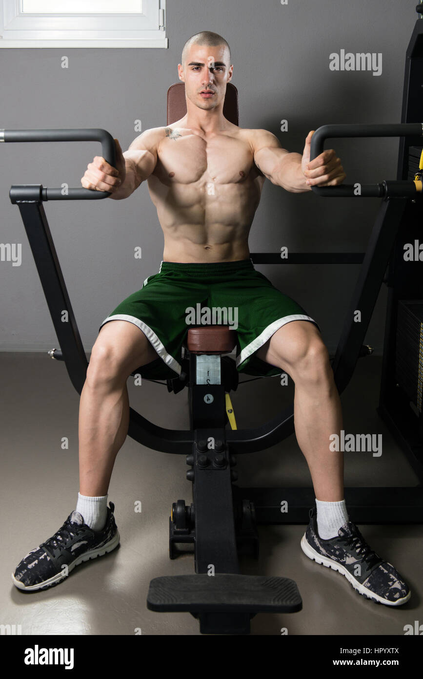 Bodybuilder Doing Heavy Weight Exercise For Chest Stock Photo - Alamy