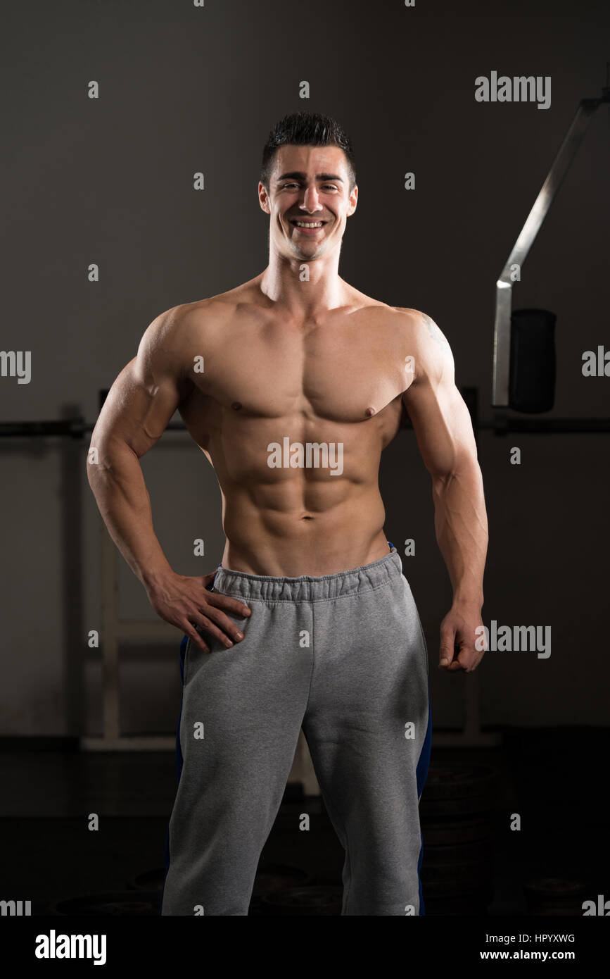 Bodybuilder Posing In Different Poses Demonstrating Their Muscles ...