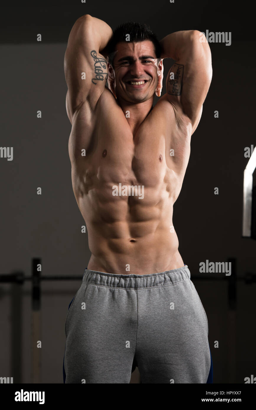 Bodybuilder Posing In Different Poses Demonstrating Their Muscles ...