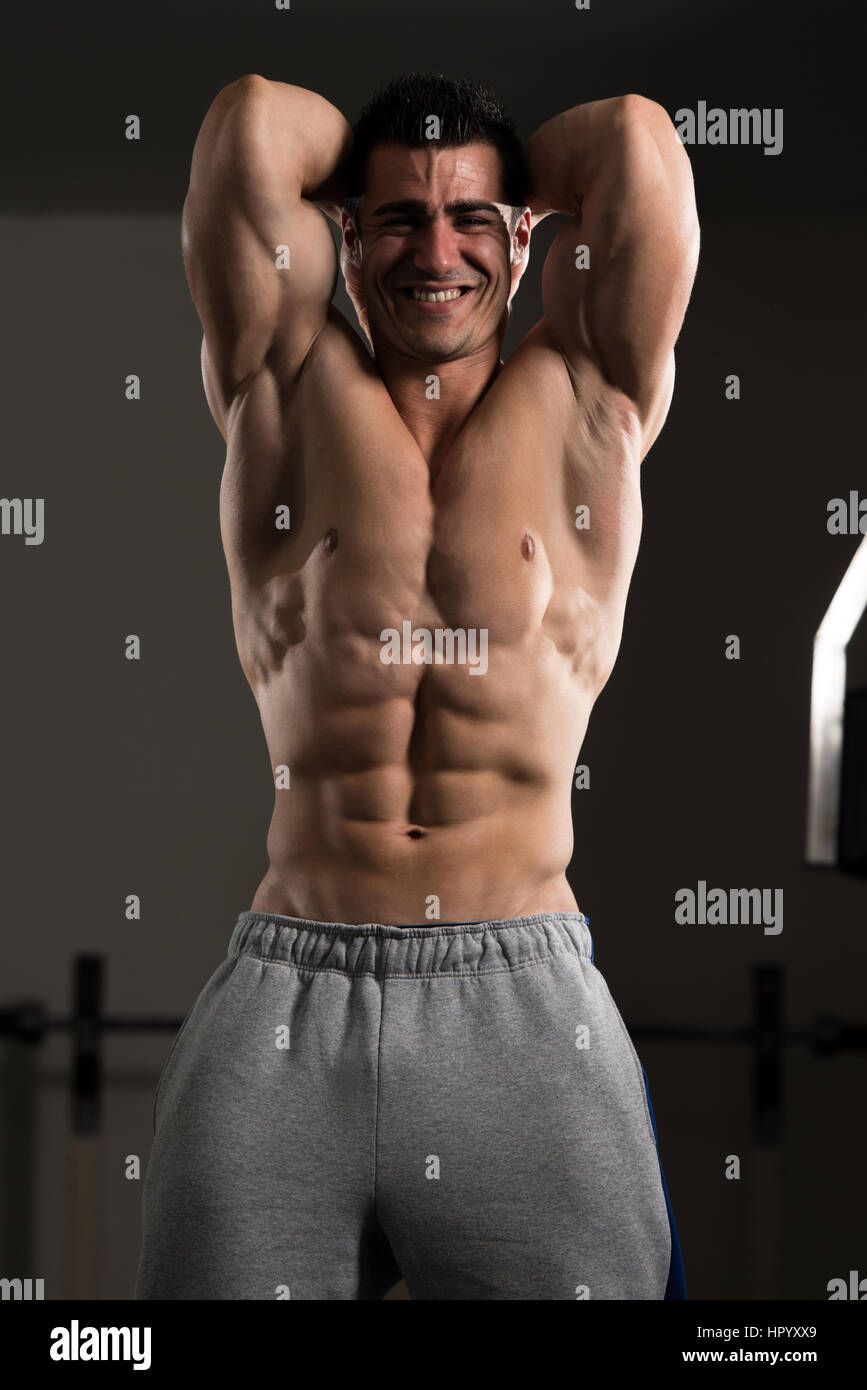 Portrait Of A Young Physically Fit Man Showing His Well Trained Body ...