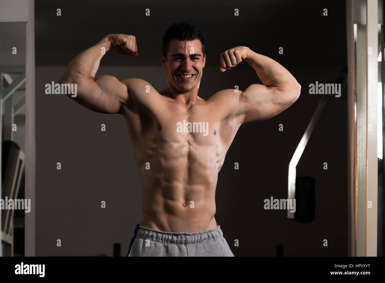 Bodybuilder Posing In Different Poses Demonstrating Their Muscles ...