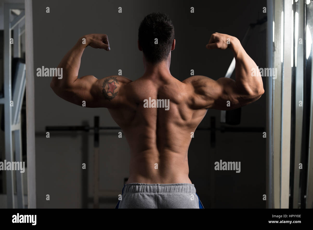 Portrait Of A Young Physically Fit Man Showing His Well Trained Body ...