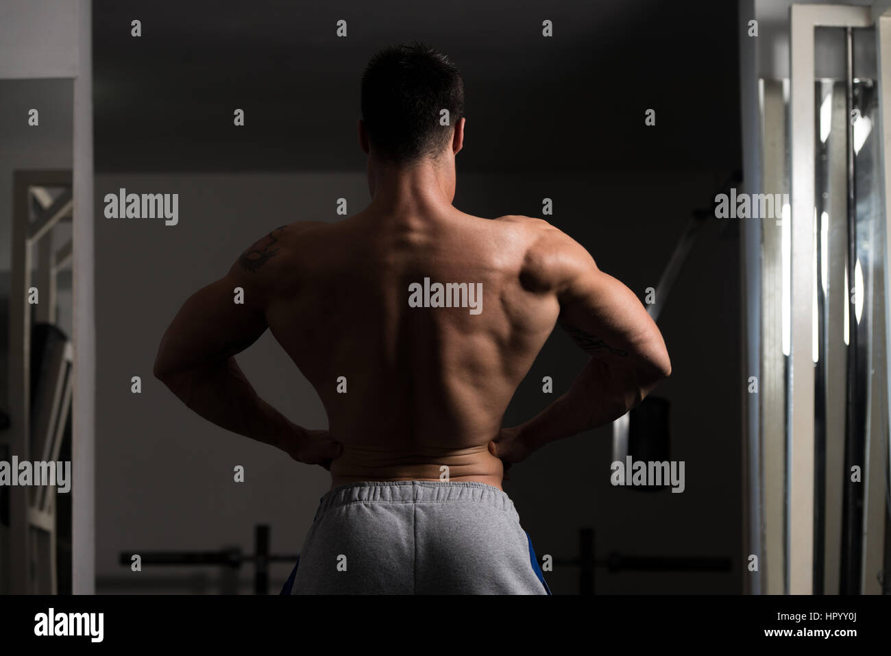 Bodybuilder Posing In Different Poses Demonstrating Their Muscles ...