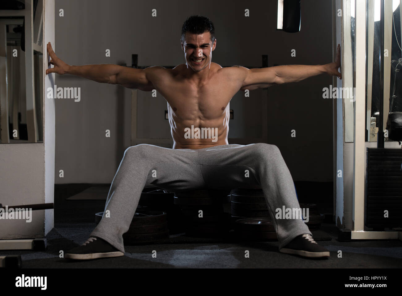 Portrait Of A Young Physically Fit Man Showing His Well Trained Body ...