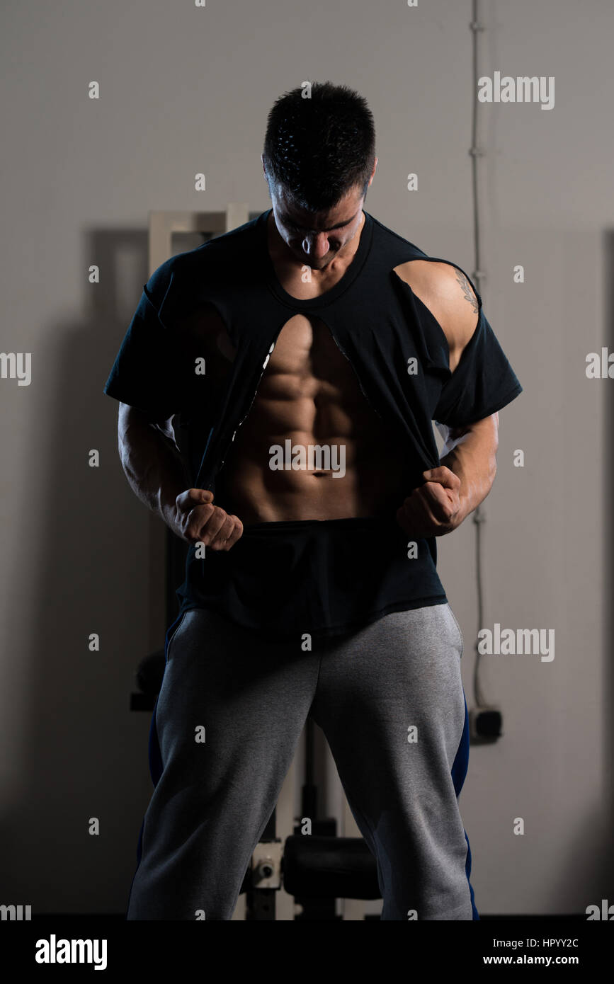 Ripping shirt hi-res stock photography and images - Alamy