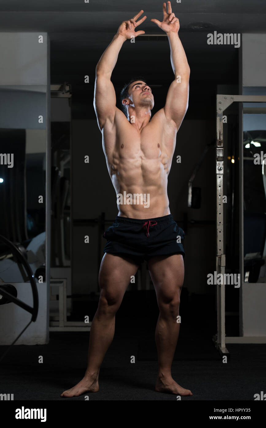 Bodybuilder Posing In Different Poses Demonstrating Their Muscles ...