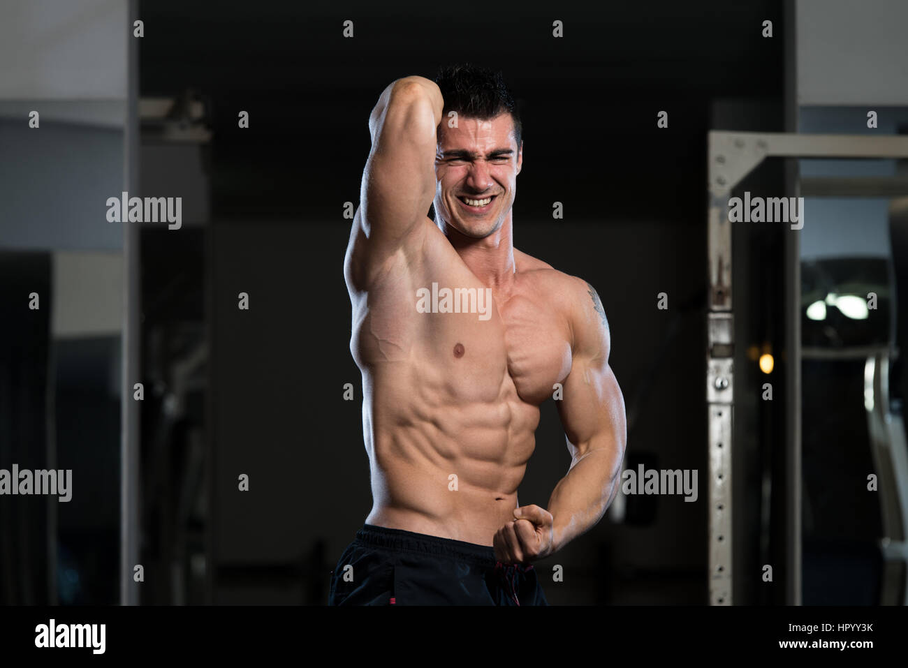 Bodybuilder Posing In Different Poses Demonstrating Their Muscles ...