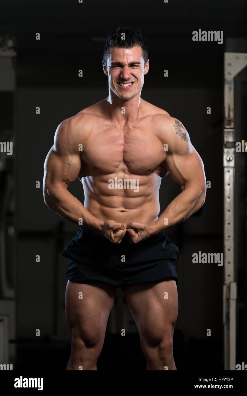 Portrait Of A Young Physically Fit Man Showing His Well Trained Body ...