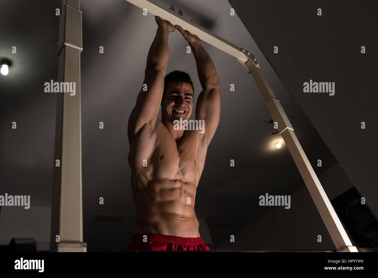 Portrait Of A Young Physically Fit Man Showing His Well Trained ...