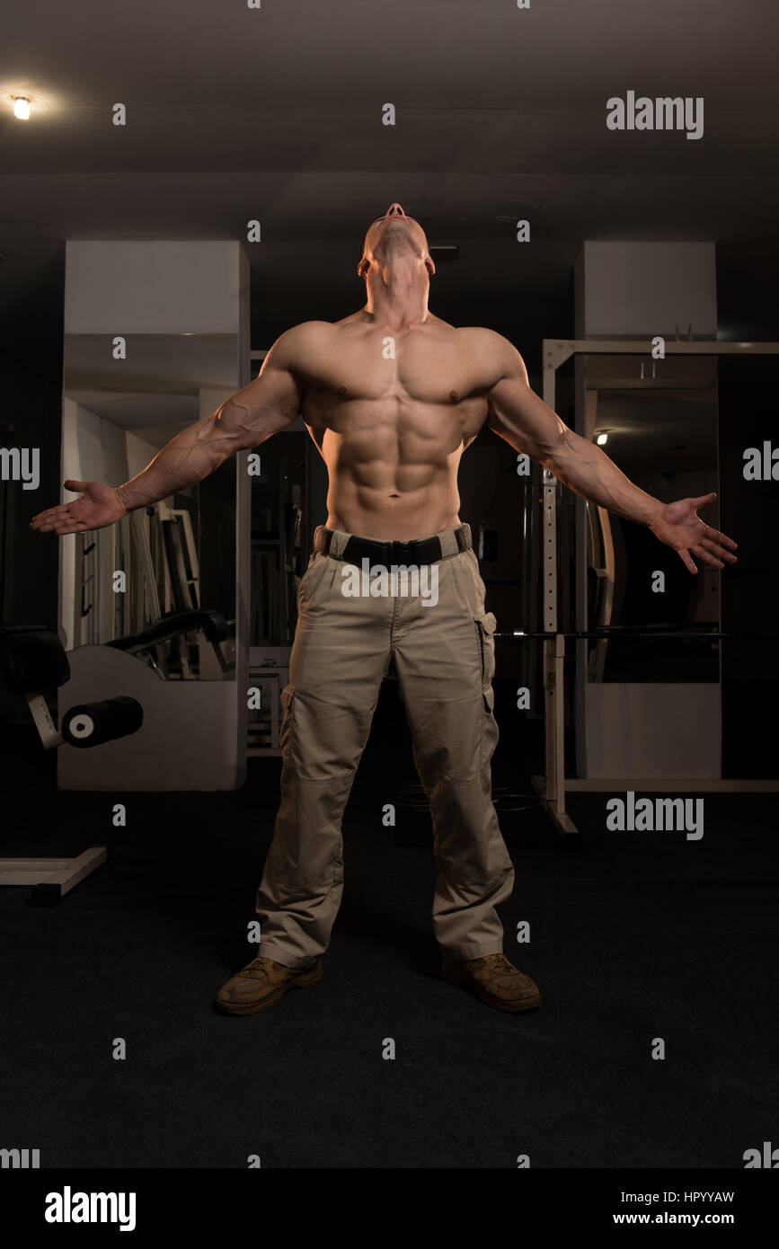 Bodybuilder Posing In Different Poses Demonstrating Their Muscles ...