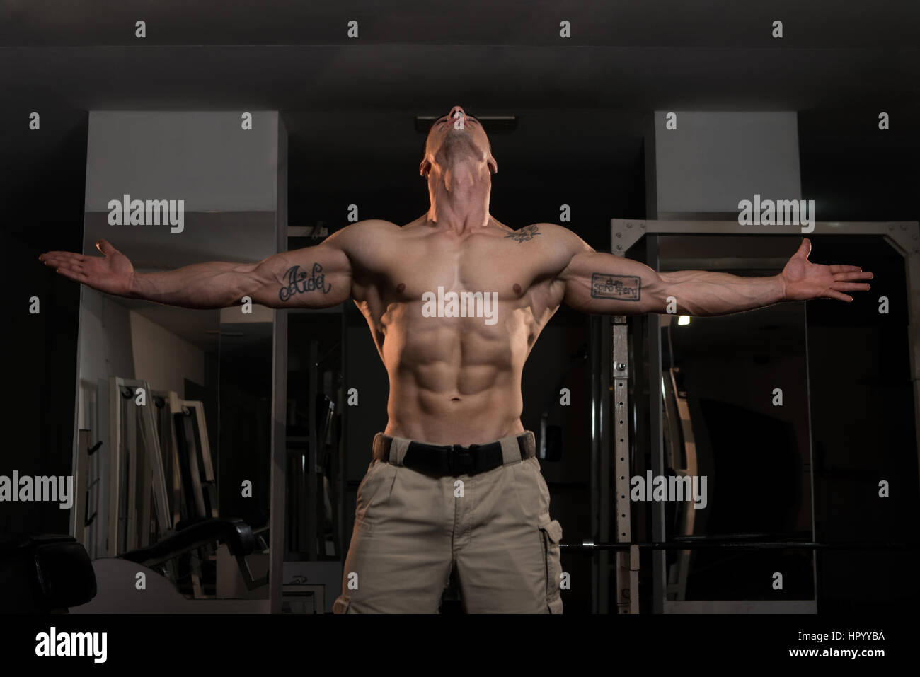 Bodybuilder Posing In Different Poses Demonstrating Their Muscles ...