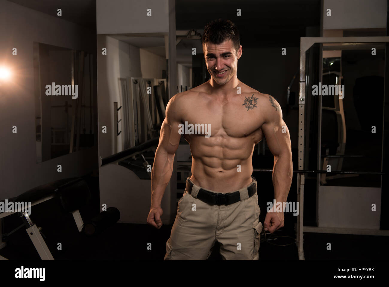 Bodybuilder Posing In Different Poses Demonstrating Their Muscles ...