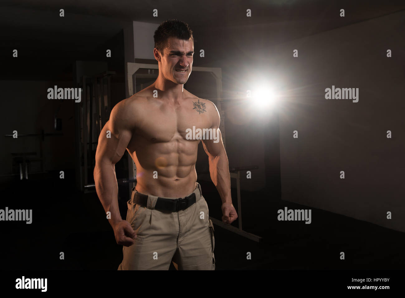 Bodybuilder Posing In Different Poses Demonstrating Their Muscles ...