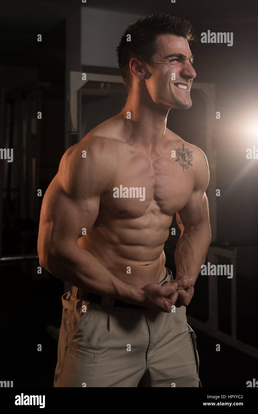 Portrait Of A Young Physically Fit Man Showing His Well Trained Body ...