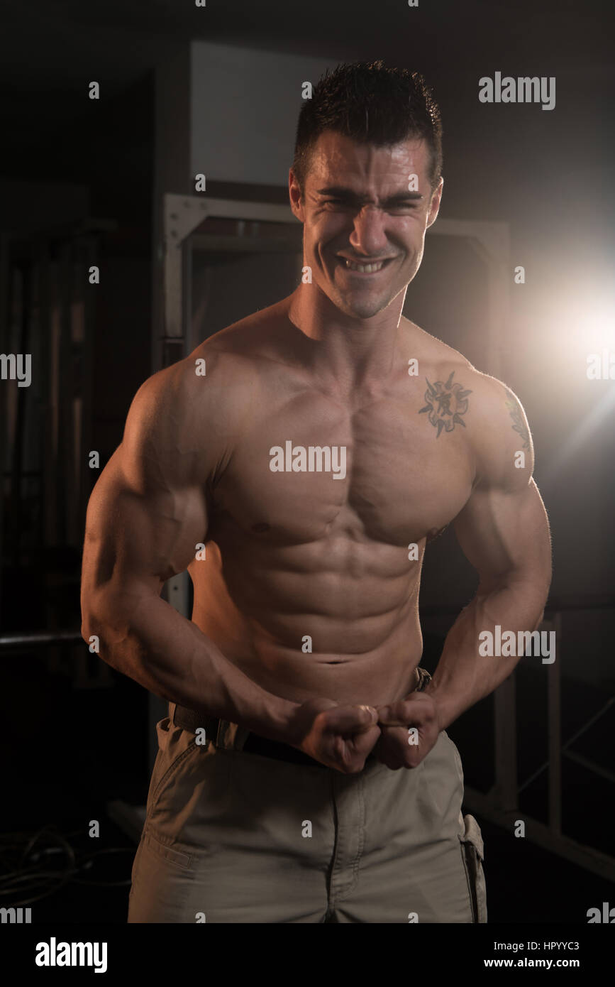 Portrait Of A Young Physically Fit Man Showing His Well Trained Body ...