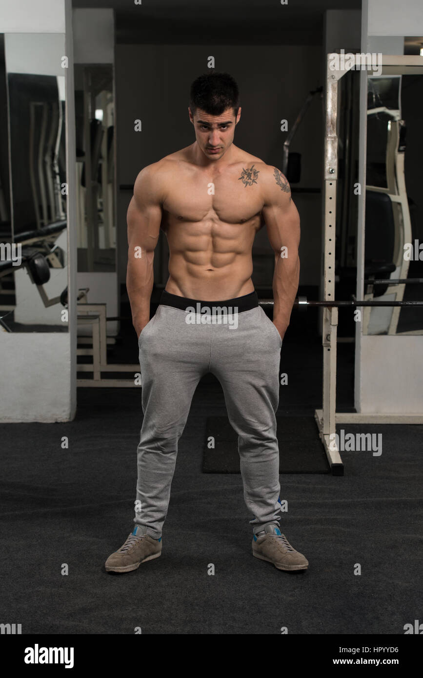 Bodybuilder Posing In Different Poses Demonstrating Their Muscles ...