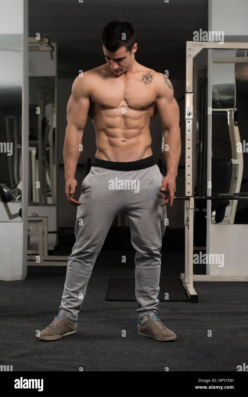 Bodybuilder Posing In Different Poses Demonstrating Their Muscles ...