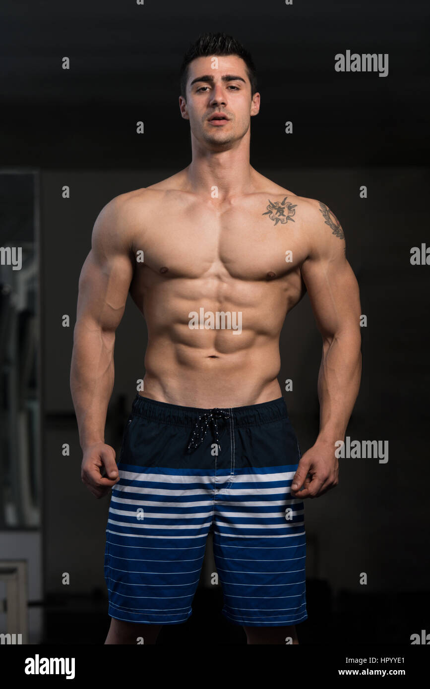 Bodybuilder Posing In Different Poses Demonstrating Their Muscles ...