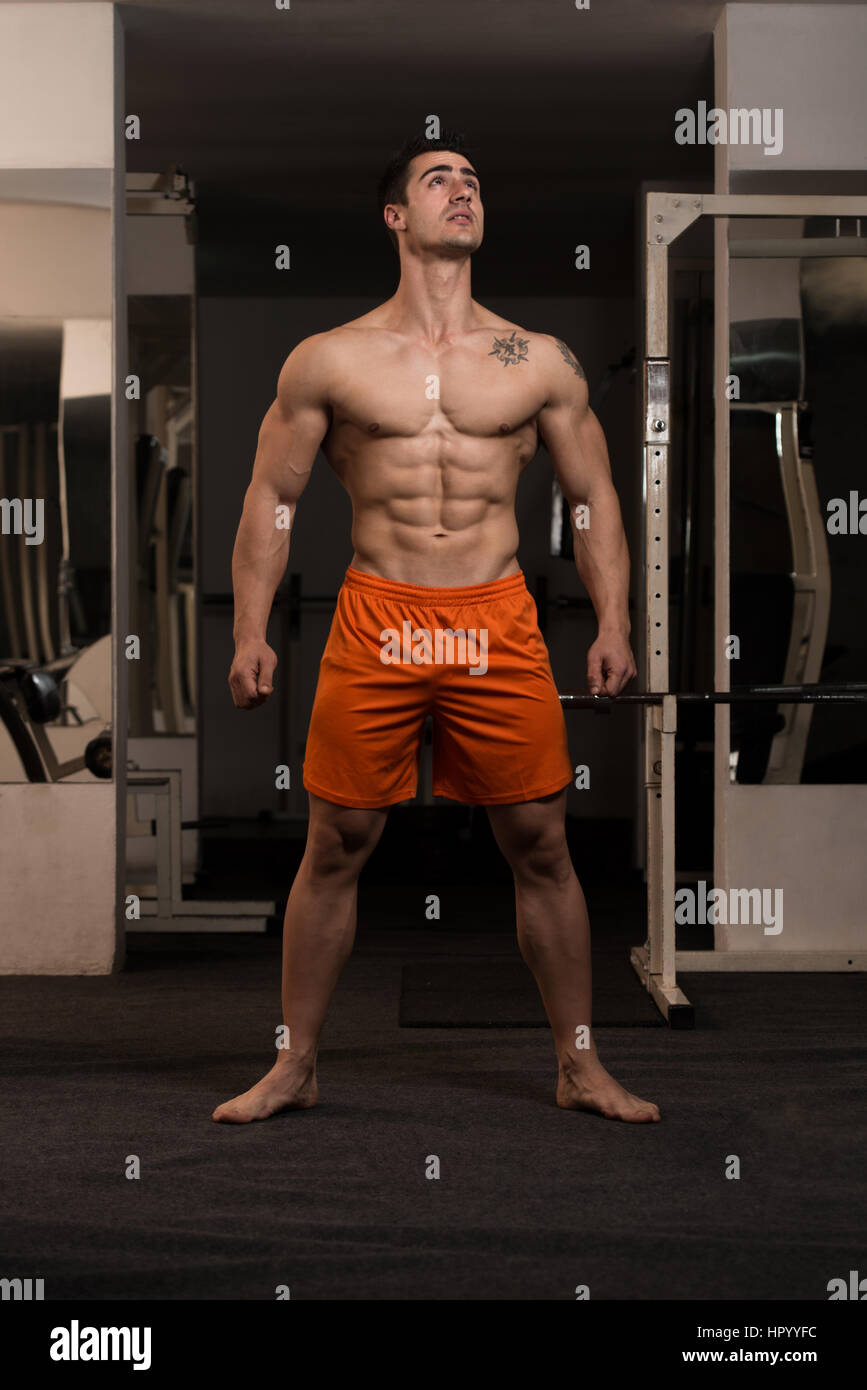 Bodybuilder Posing In Different Poses Demonstrating Their Muscles ...