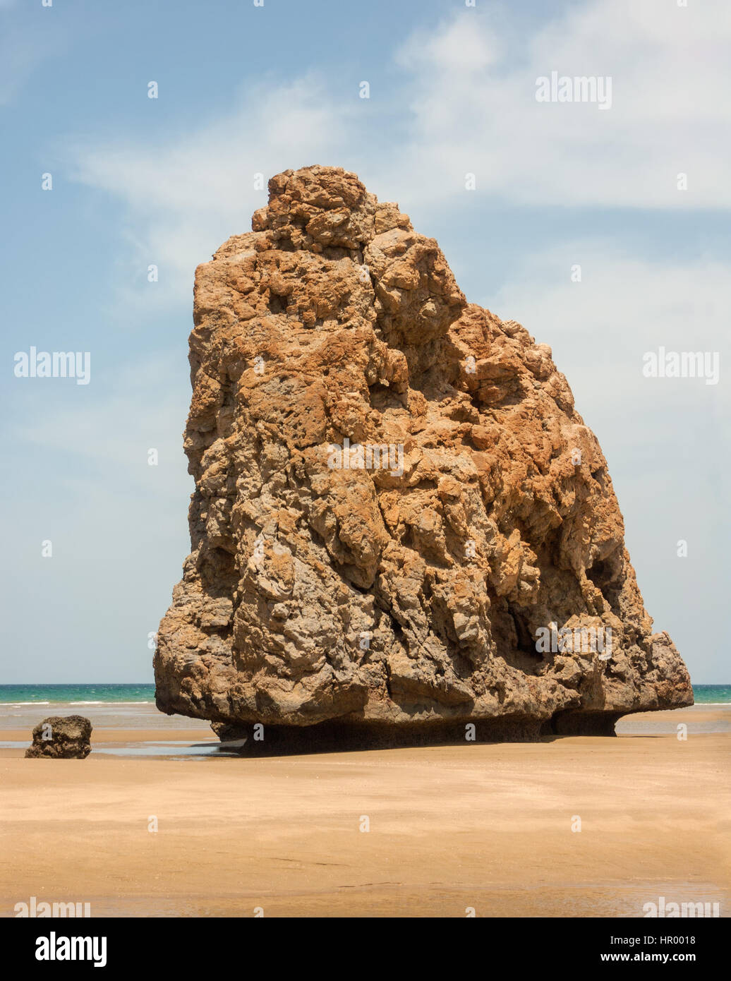 large rock at beach in Oman Stock Photo - Alamy