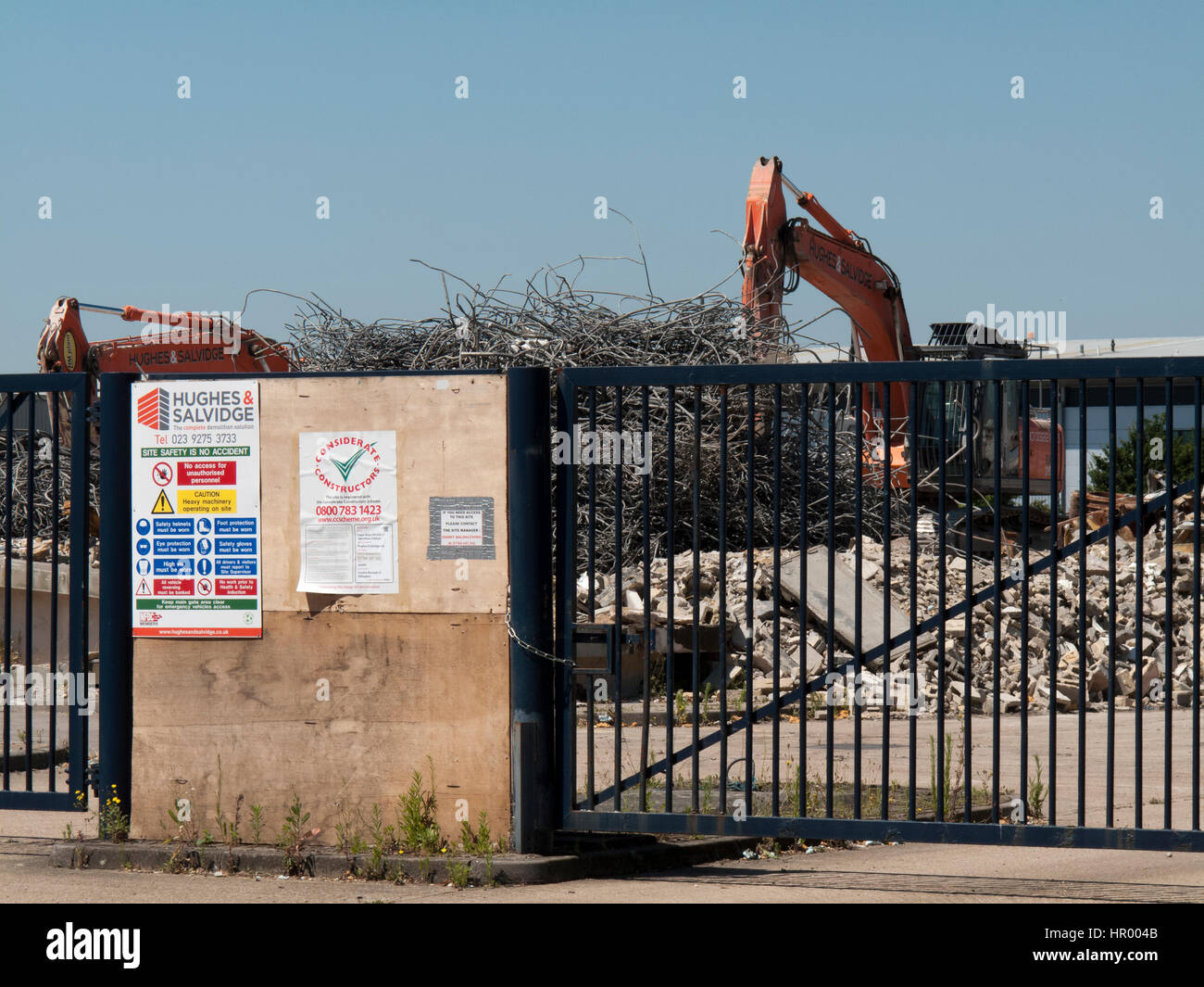 Construction site entrance to demolition works with health and safety ...