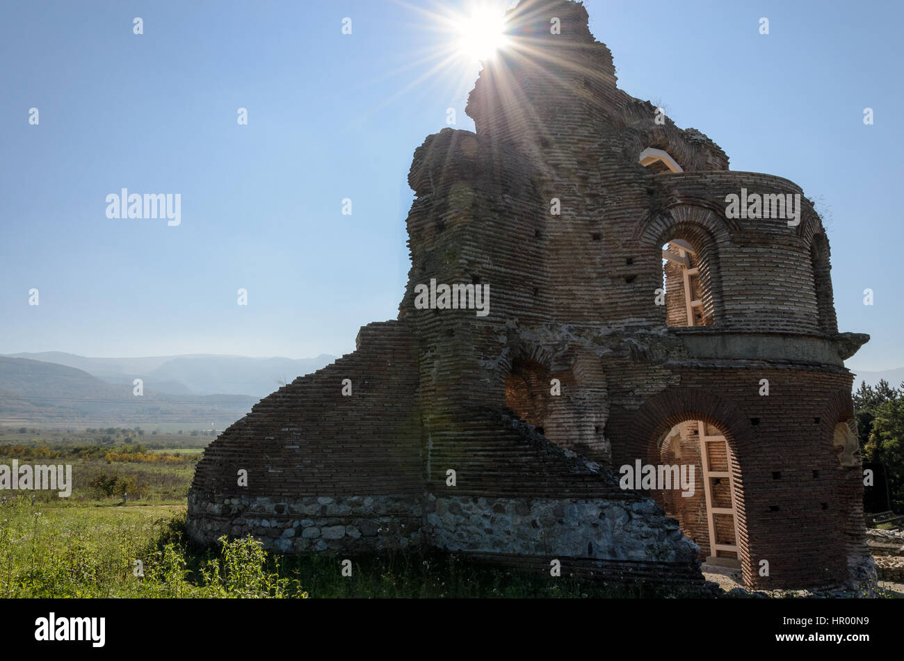 Side view and sun rays at archaeological remains of the Red Church near ...
