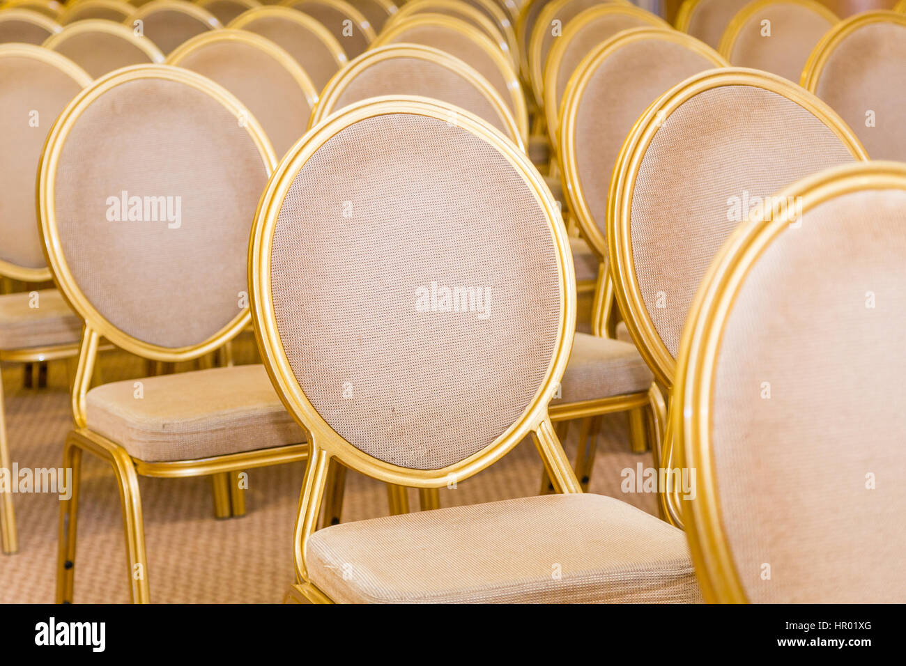 rank of empty chairs in vintage style with round seat back in ...