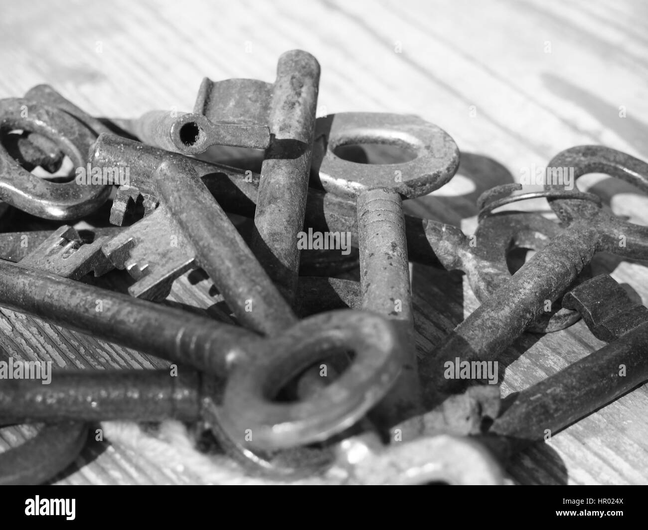 Close up view of old keys on wooden desk Stock Photo - Alamy