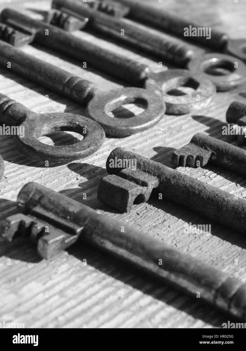 Close up view of old keys on wooden desk Stock Photo - Alamy