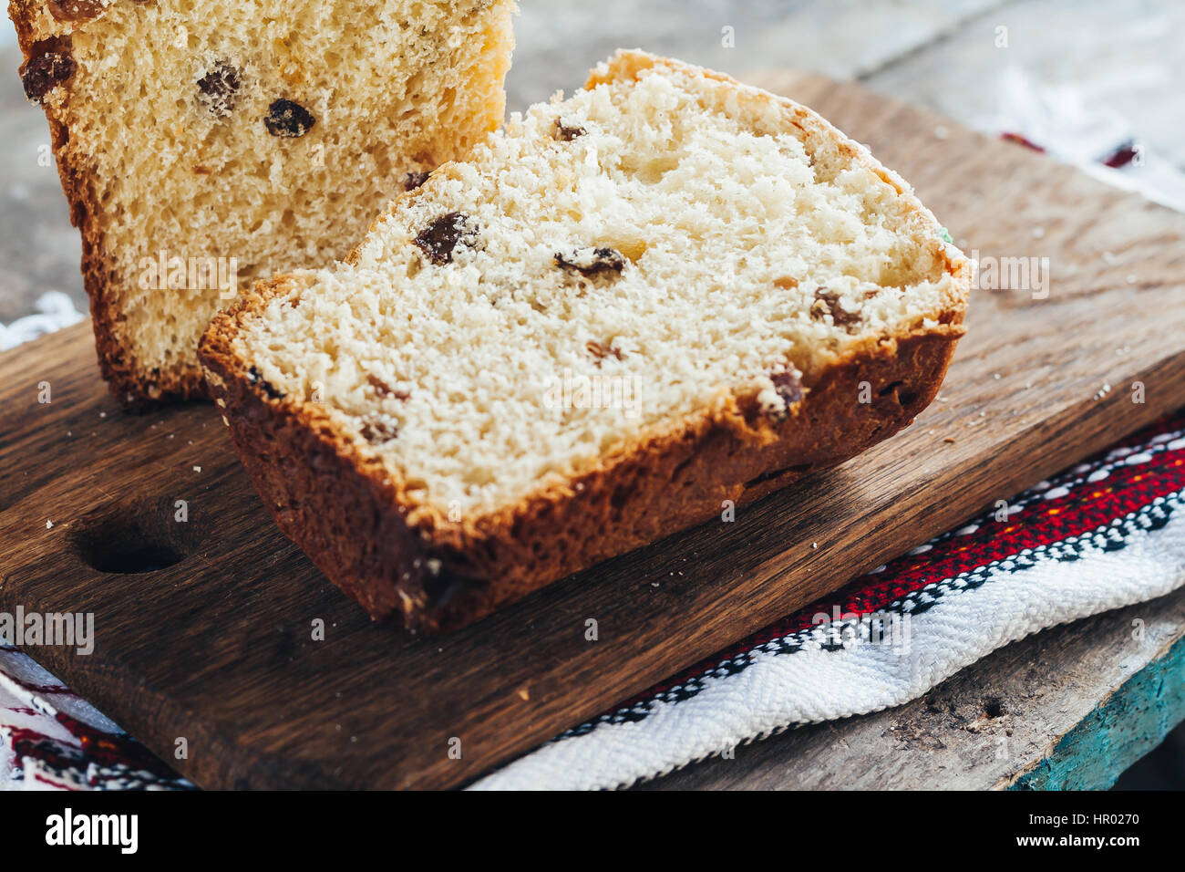 Close-up of cut a hunk traditional Easter kulich Stock Photo - Alamy