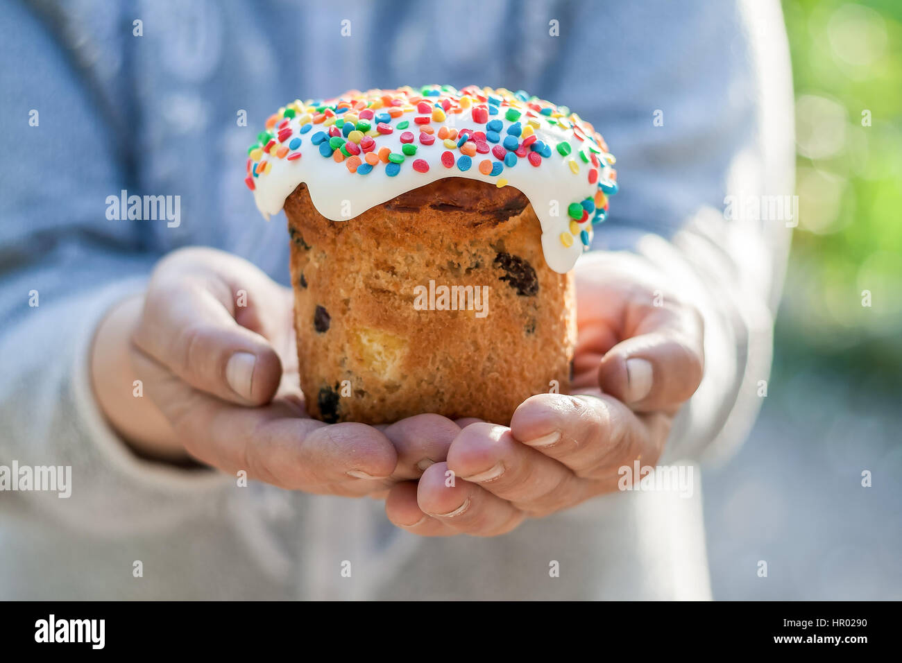 Women's hands hold decorated Easter cake, close-up Stock Photo - Alamy