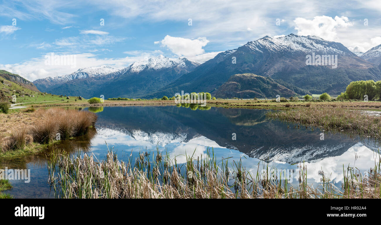 Mountain range reflected in a lake, Matukituki Valley, Mount Aspiring ...